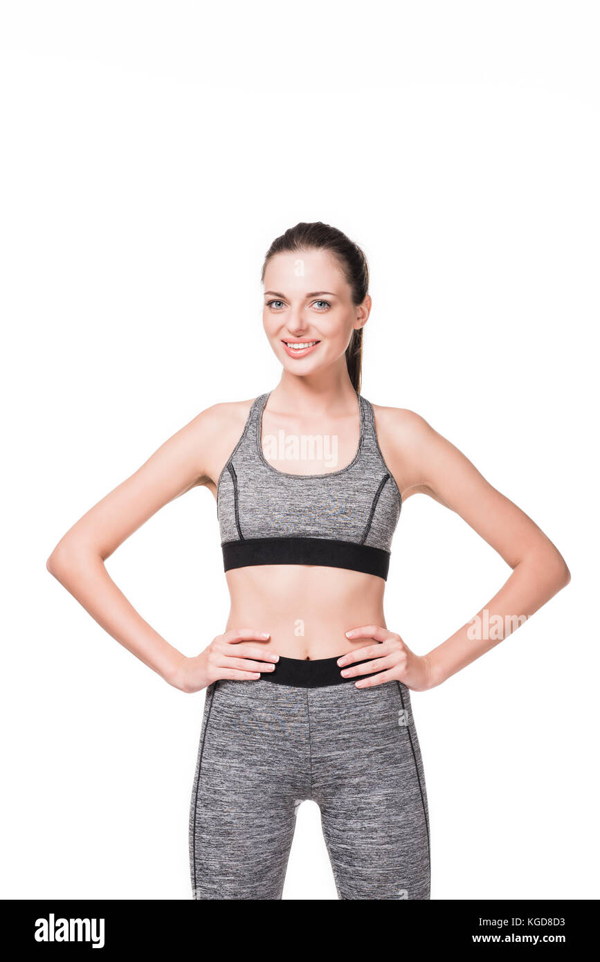 happy sportswoman with hands on waist Stock Photo - Alamy