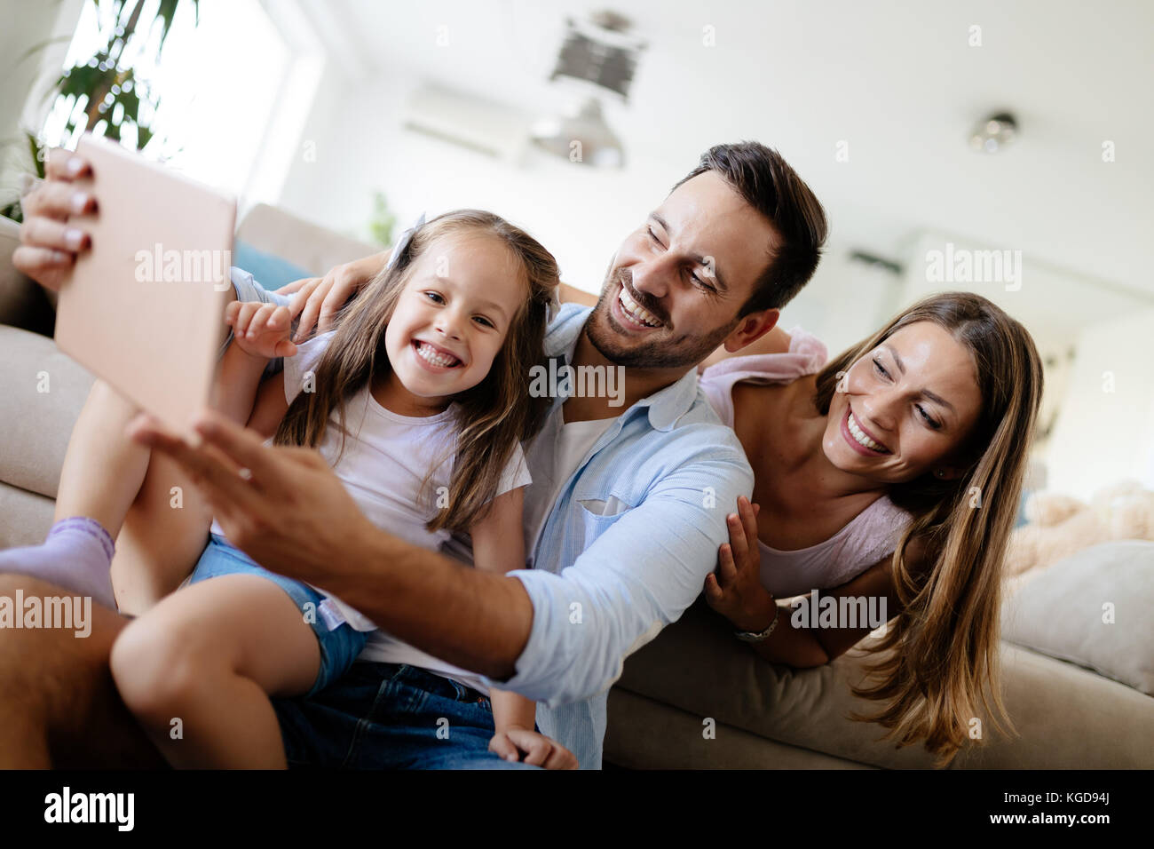Happy family having fun times at home Stock Photo - Alamy