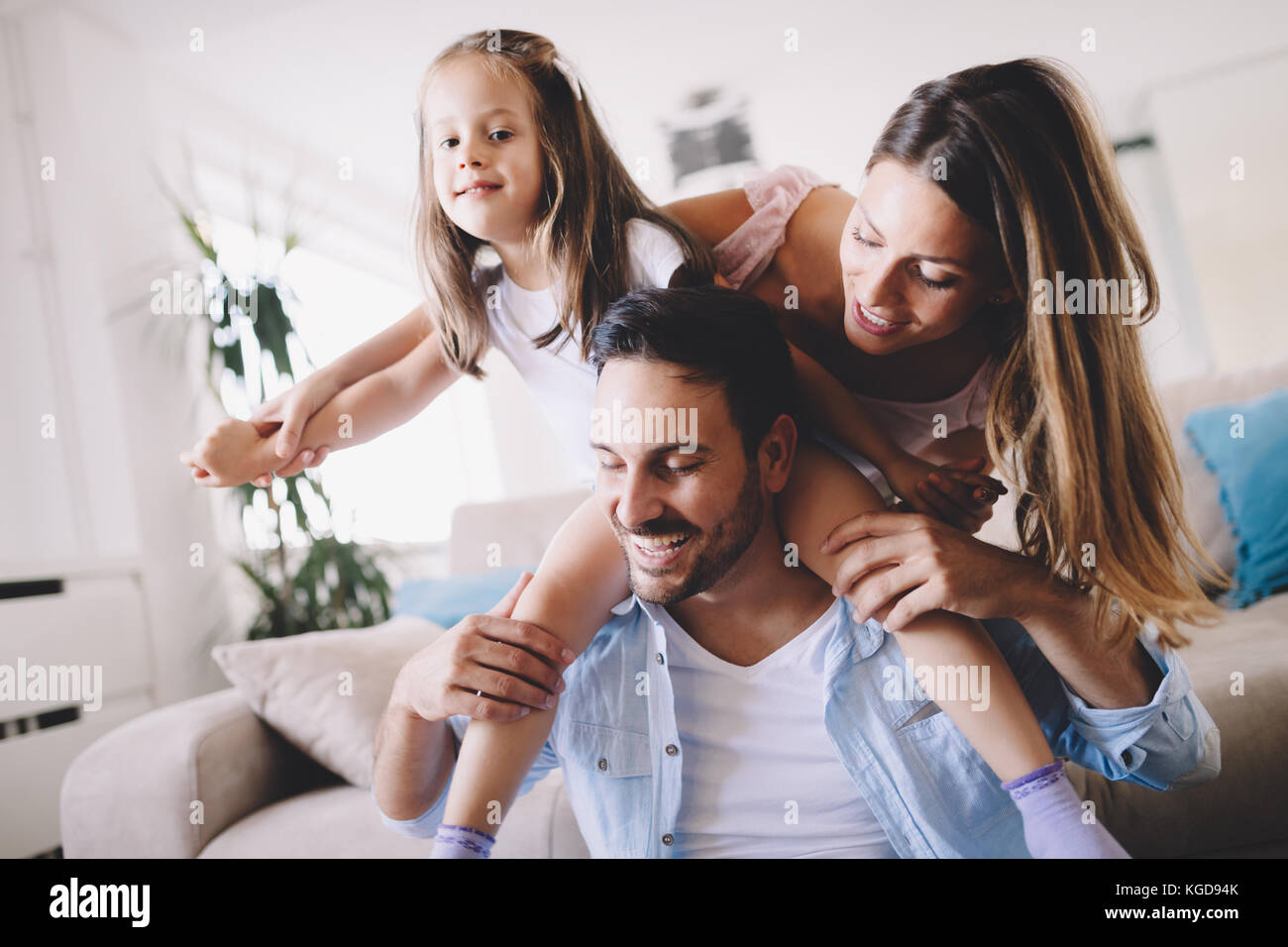 Happy family having fun times at home Stock Photo - Alamy