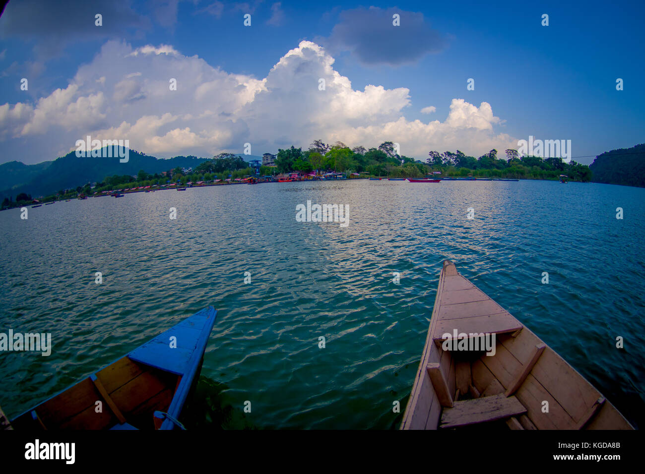 Close up of the tip of the boat with a beautiful landscape of the Phewa ...