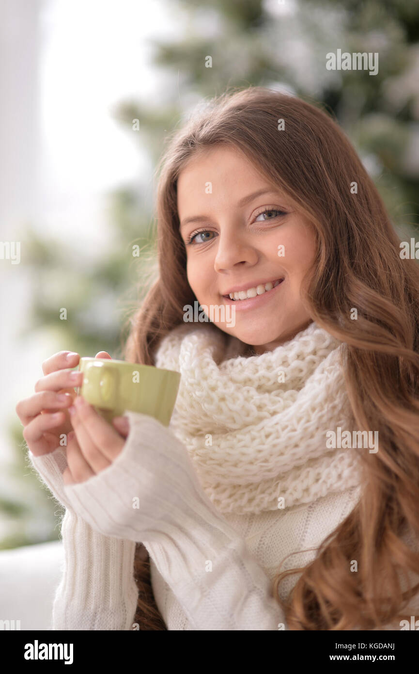 teenage girl with cup of tea Stock Photo - Alamy