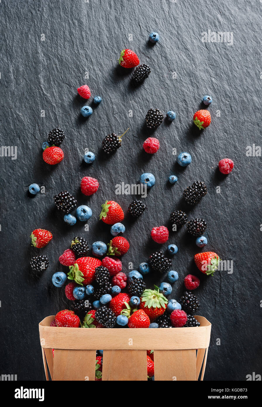 Explosion of different berries. Photo of strawberry, blueberry ...