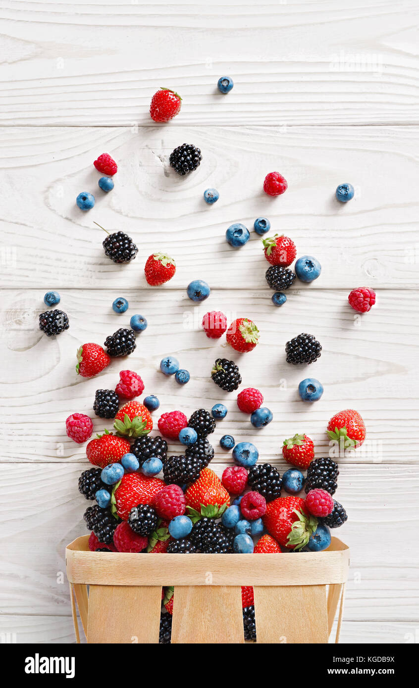 Explosion of different berries. Photo of strawberry, blueberry ...