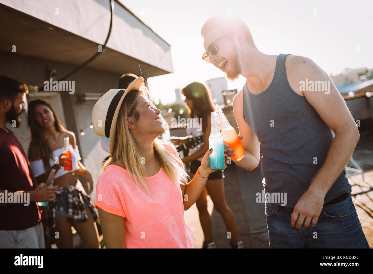 Happy couple having fun time at party Stock Photo - Alamy