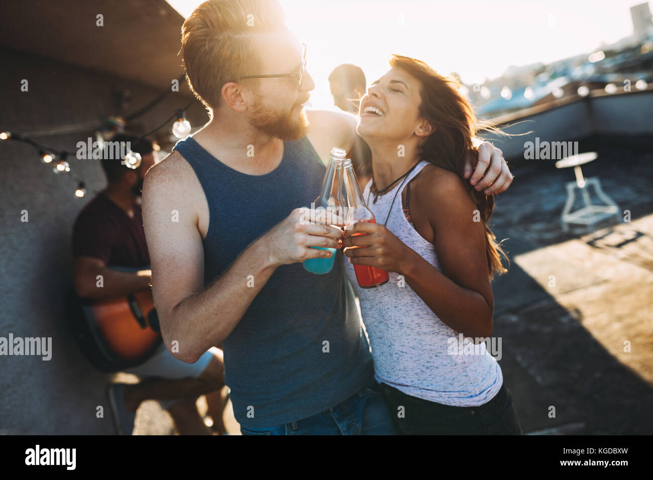 Happy couple having fun time at party Stock Photo - Alamy