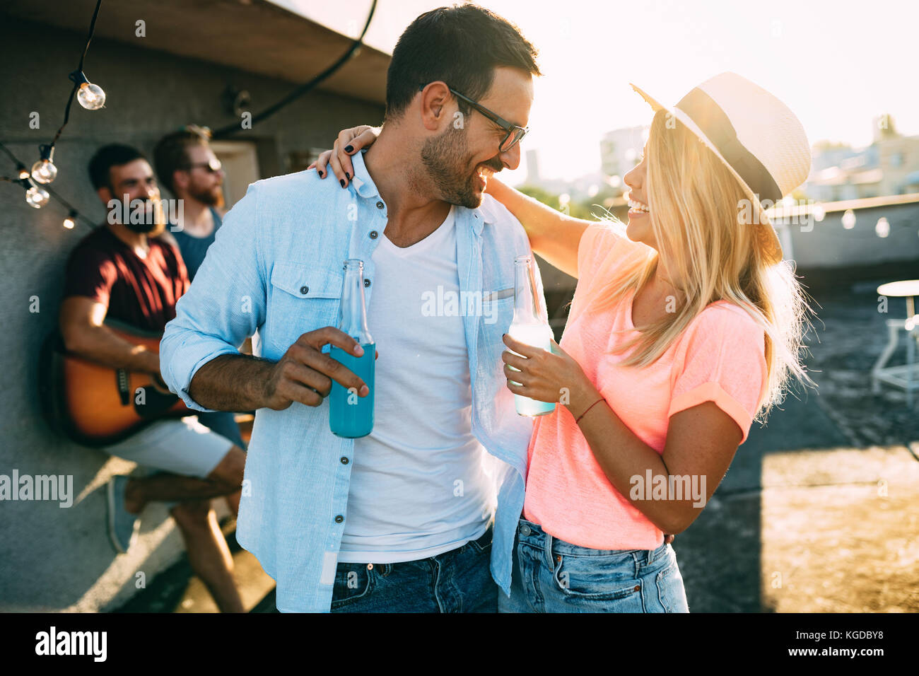 Happy couple having fun time at party Stock Photo - Alamy