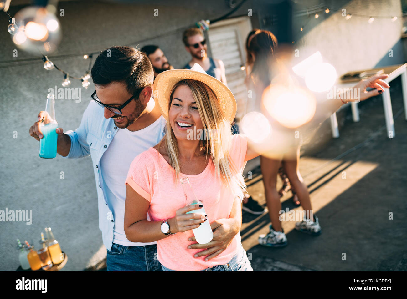 Happy couple having fun time at party Stock Photo - Alamy