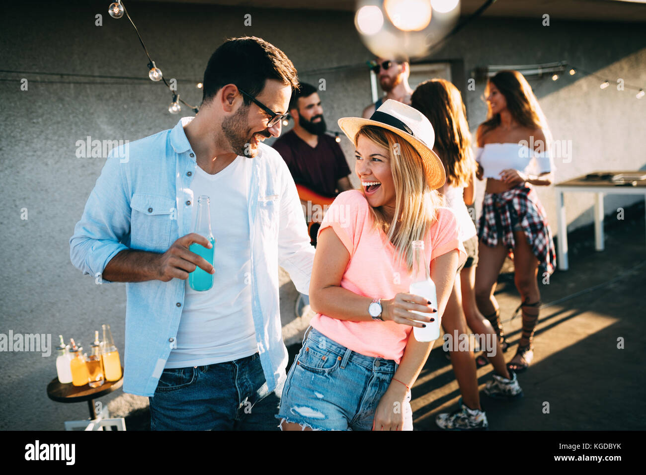 Happy couple having fun time at party Stock Photo - Alamy