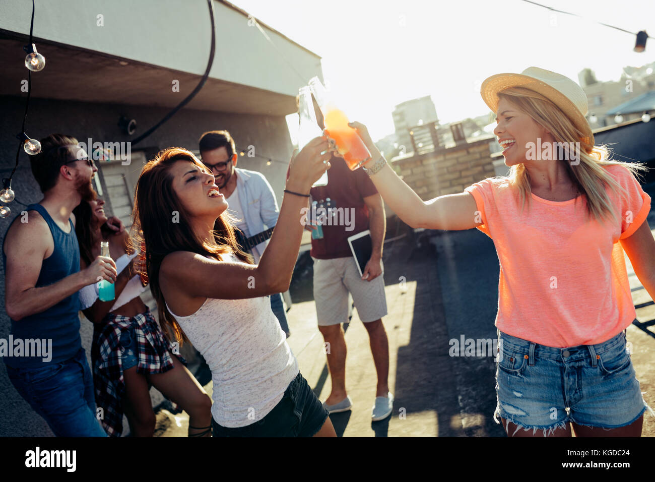 Happy young girls having fun at party Stock Photo - Alamy