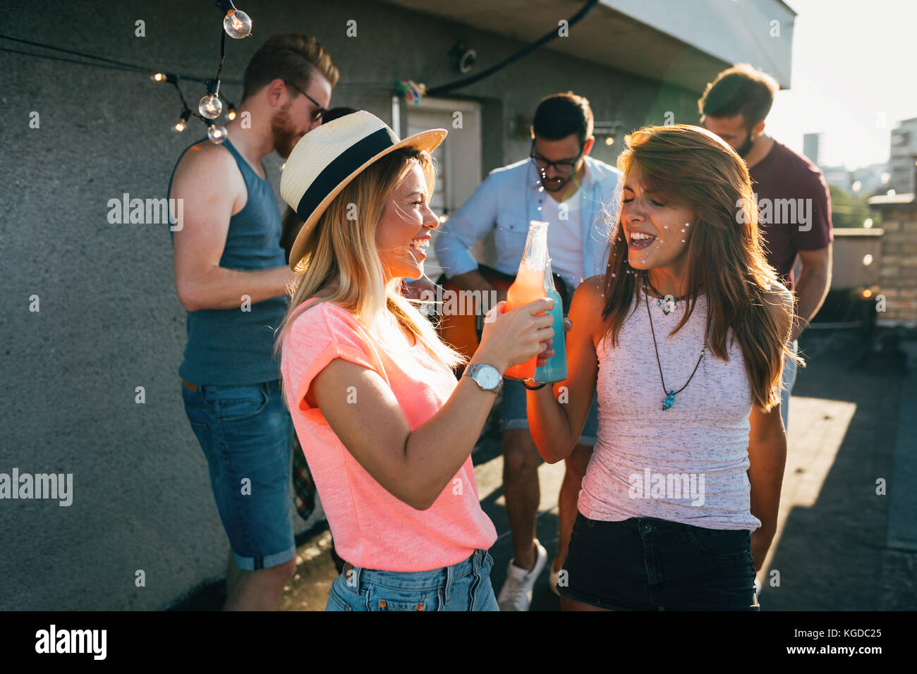 Happy young girls having fun at party Stock Photo - Alamy