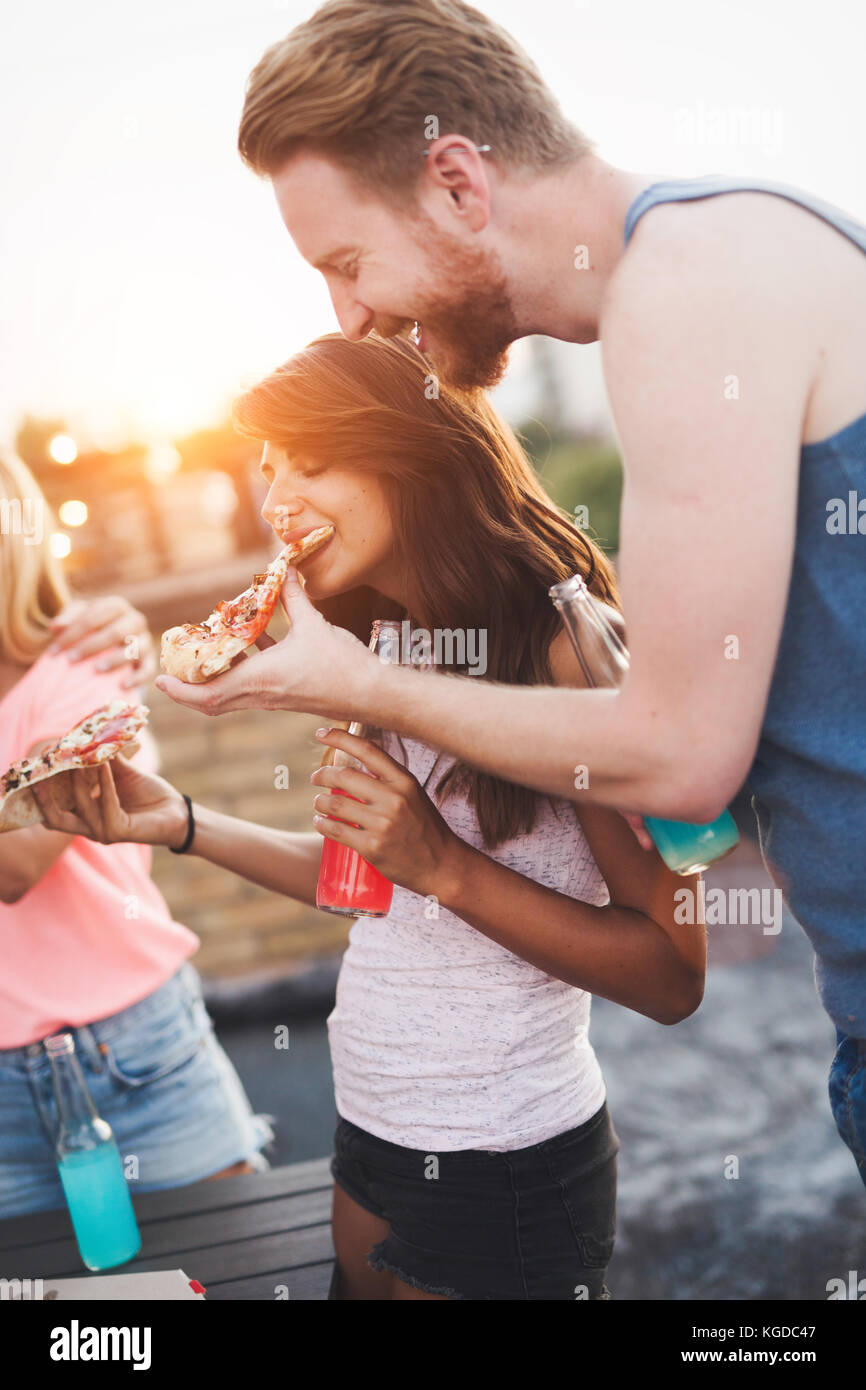 Happy couple having fun time at party Stock Photo - Alamy