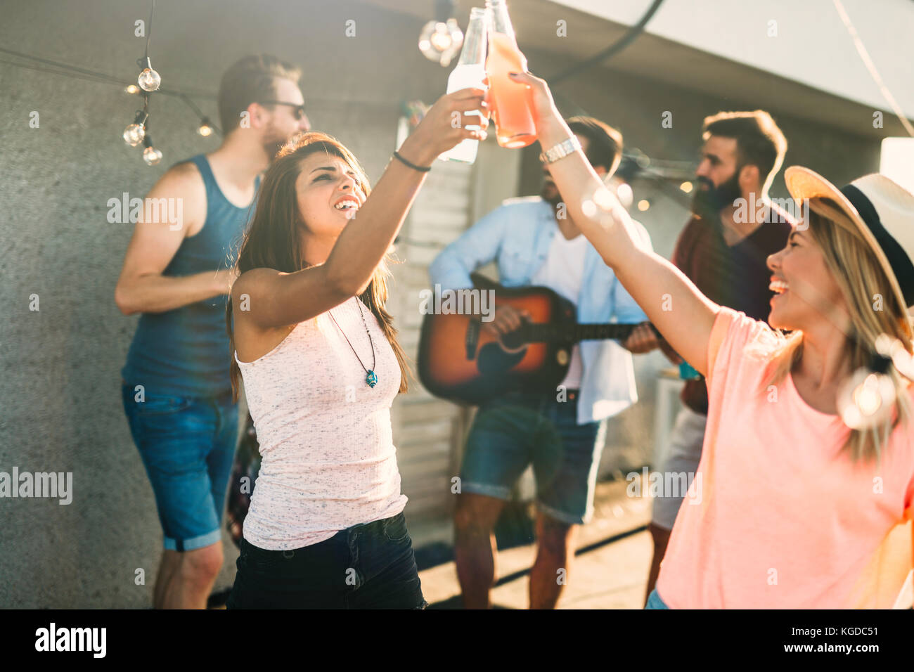 Happy young girls having fun at party Stock Photo - Alamy