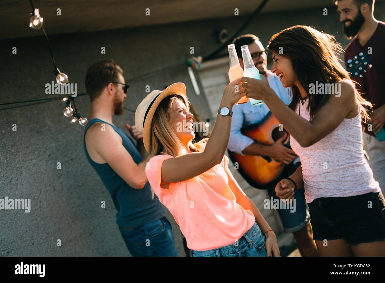 Happy young girls having fun at party Stock Photo - Alamy