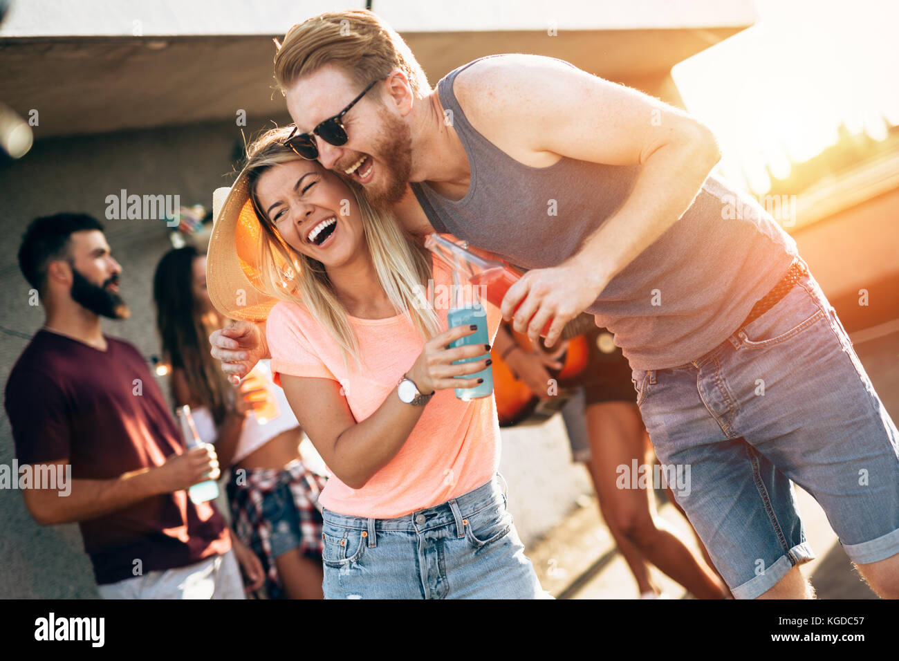 Happy couple having fun time at party Stock Photo - Alamy