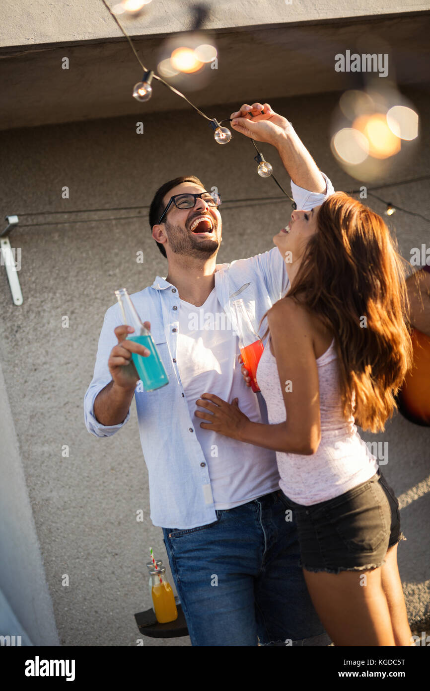 Happy couple having fun time at party Stock Photo - Alamy