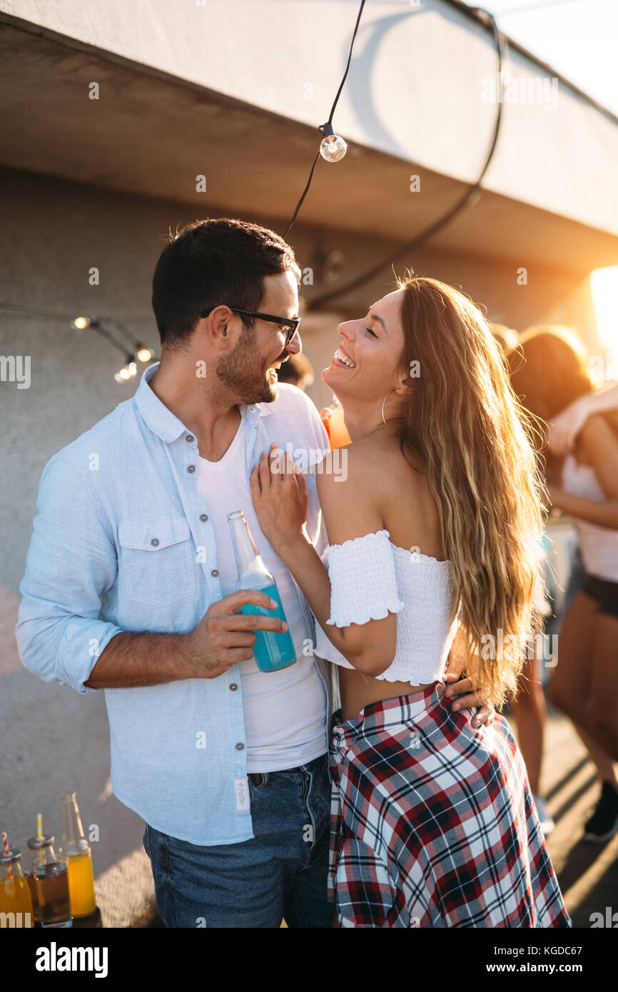 Happy couple having fun time at party Stock Photo - Alamy