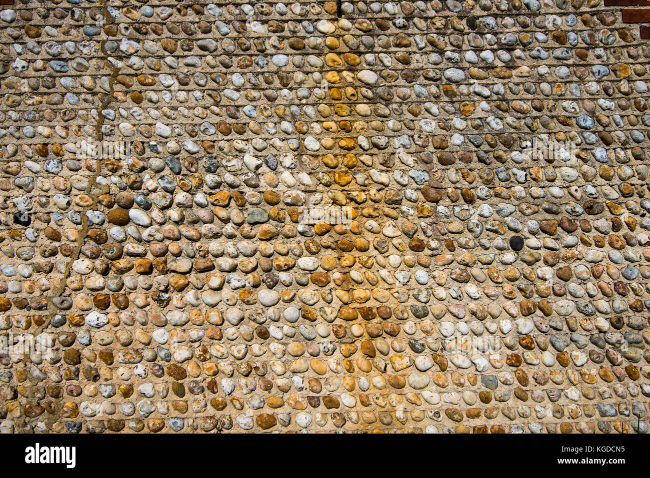 Beach-stone walling background and art Stock Photo - Alamy