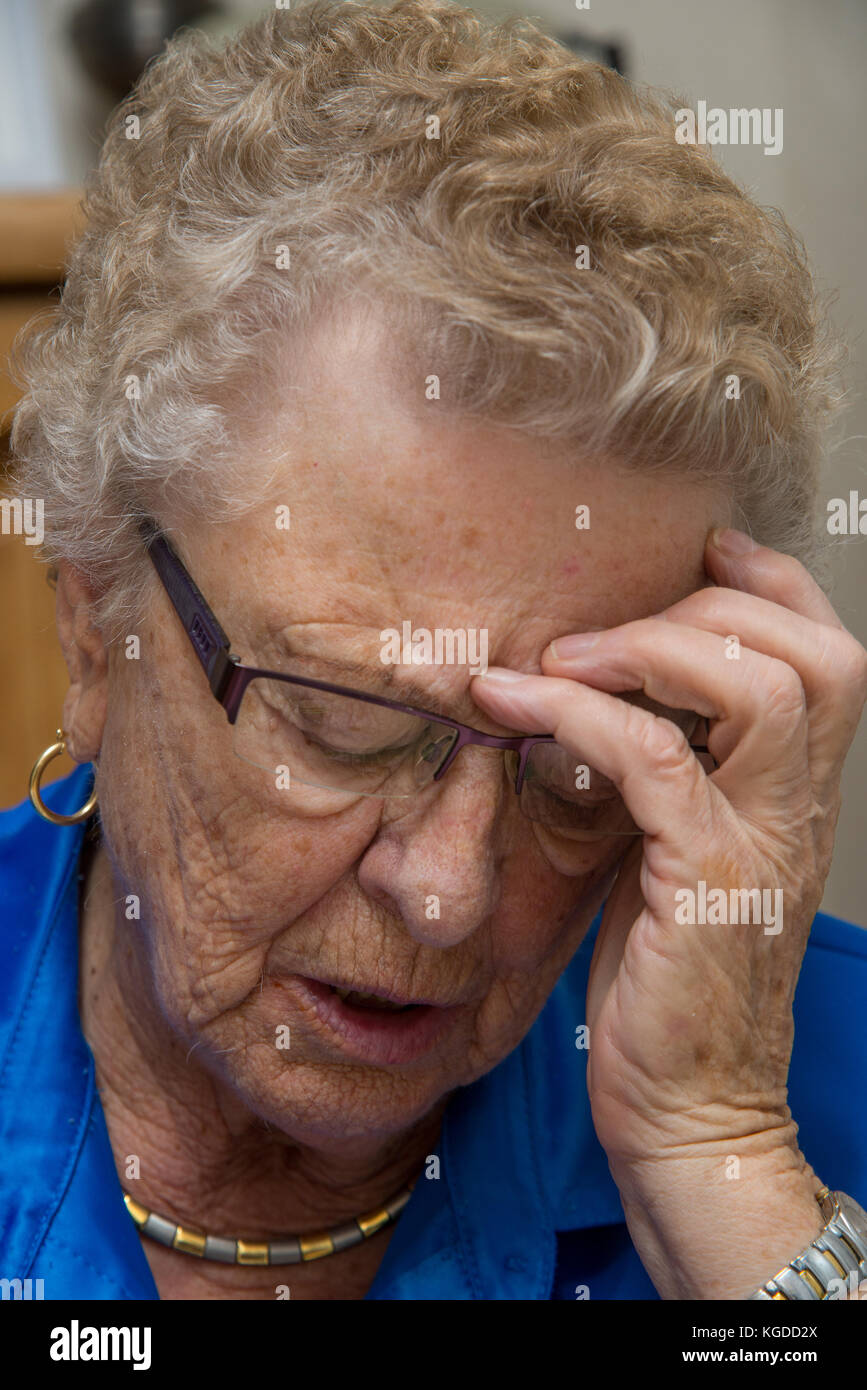 portrait of thinking old woman Stock Photo - Alamy