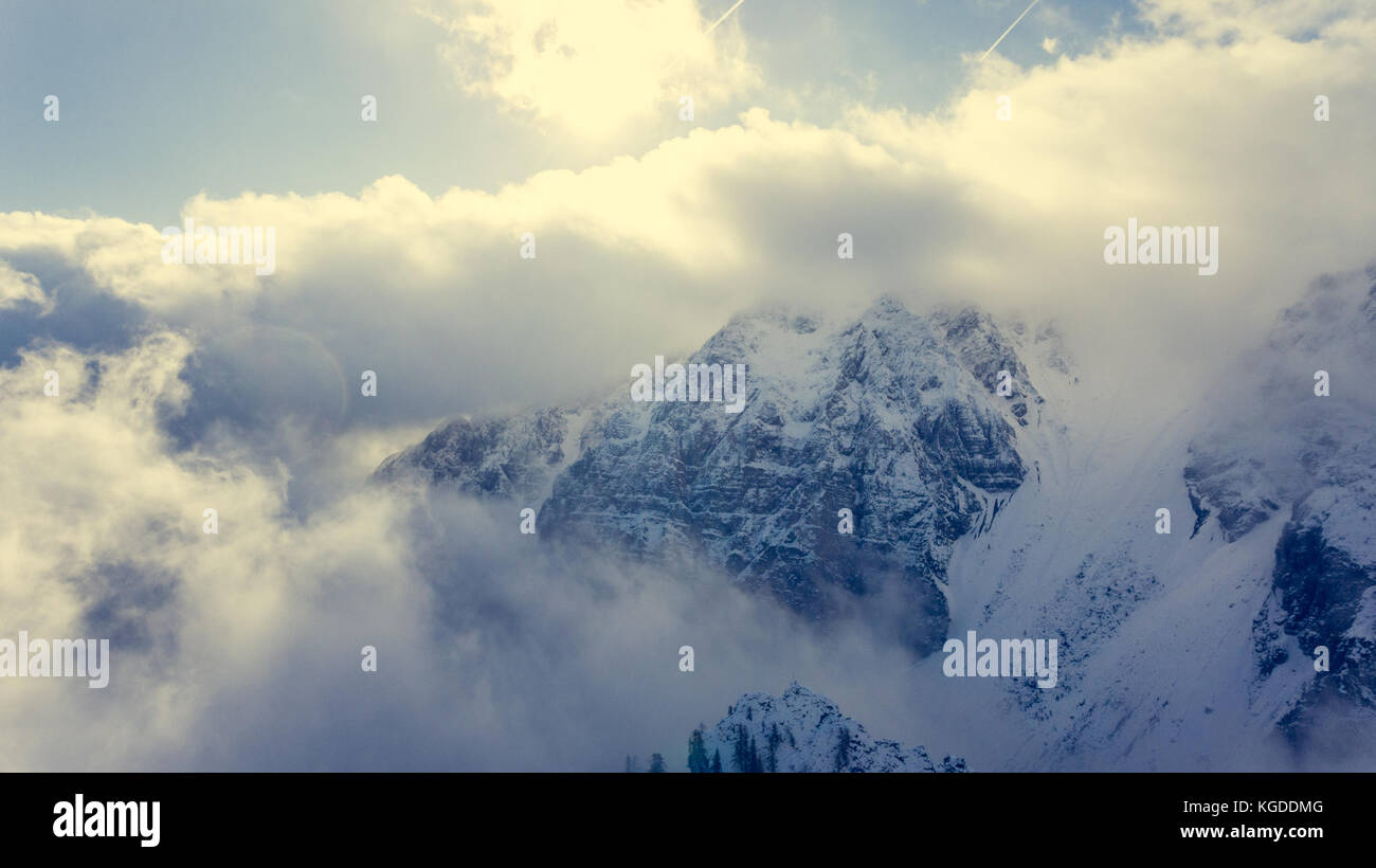Aerial view of clouds circling around mountain ridge Stock Photo - Alamy