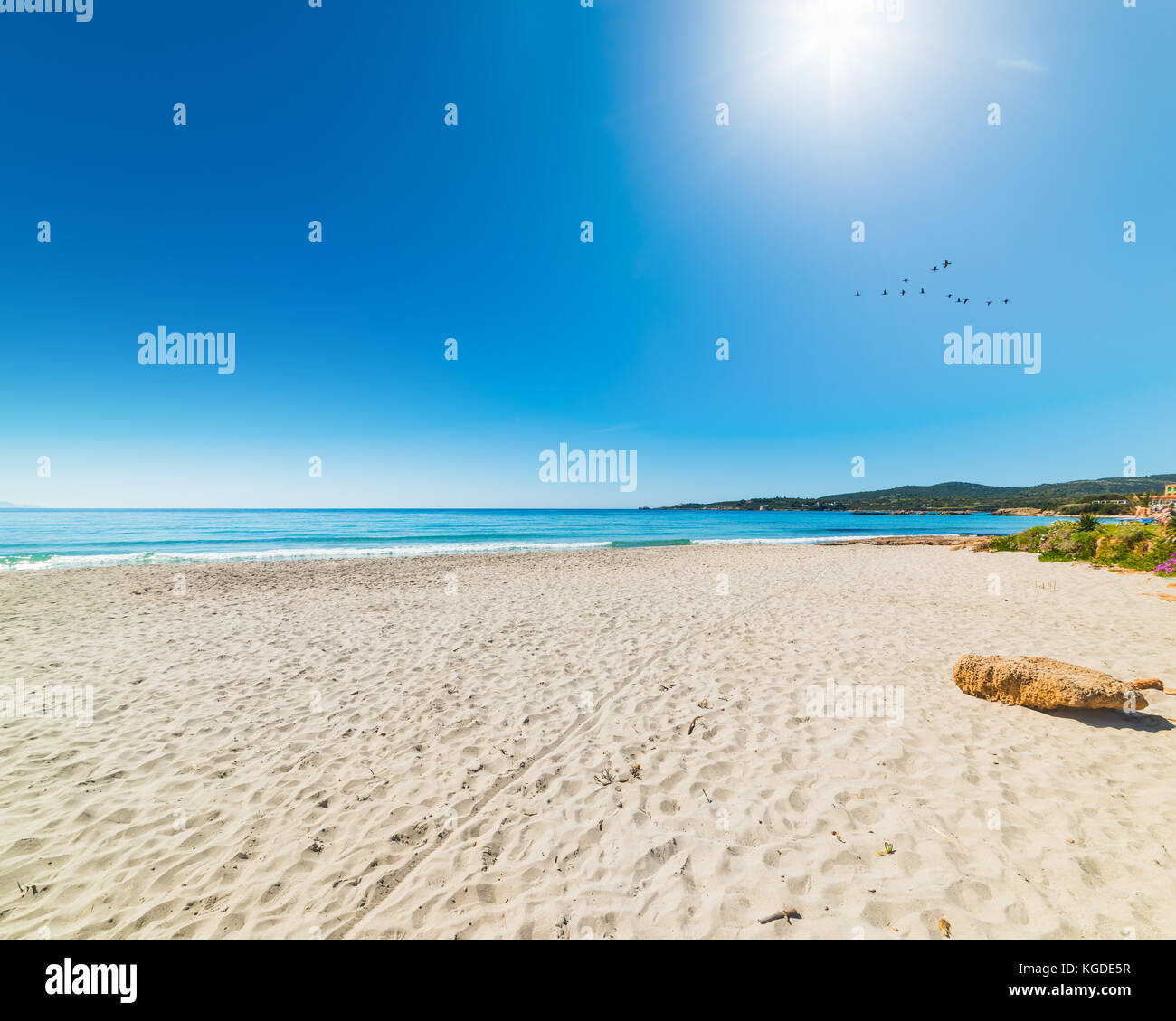 clear blue sky over Le Bombarde beach, Sardinia Stock Photo - Alamy