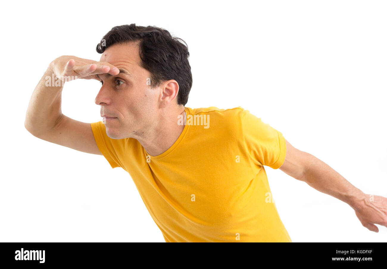 Man is looking for something. Watchful man is struggling to see from ...