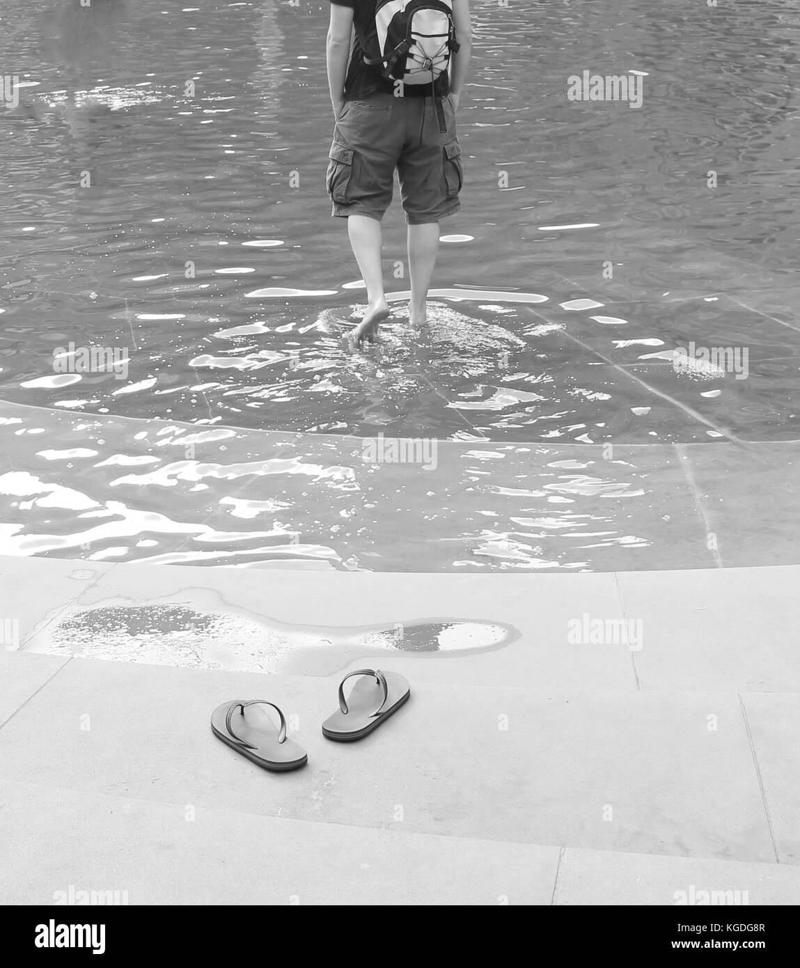 man wade in water pond fountain shoes on shore stock photo, stock ...