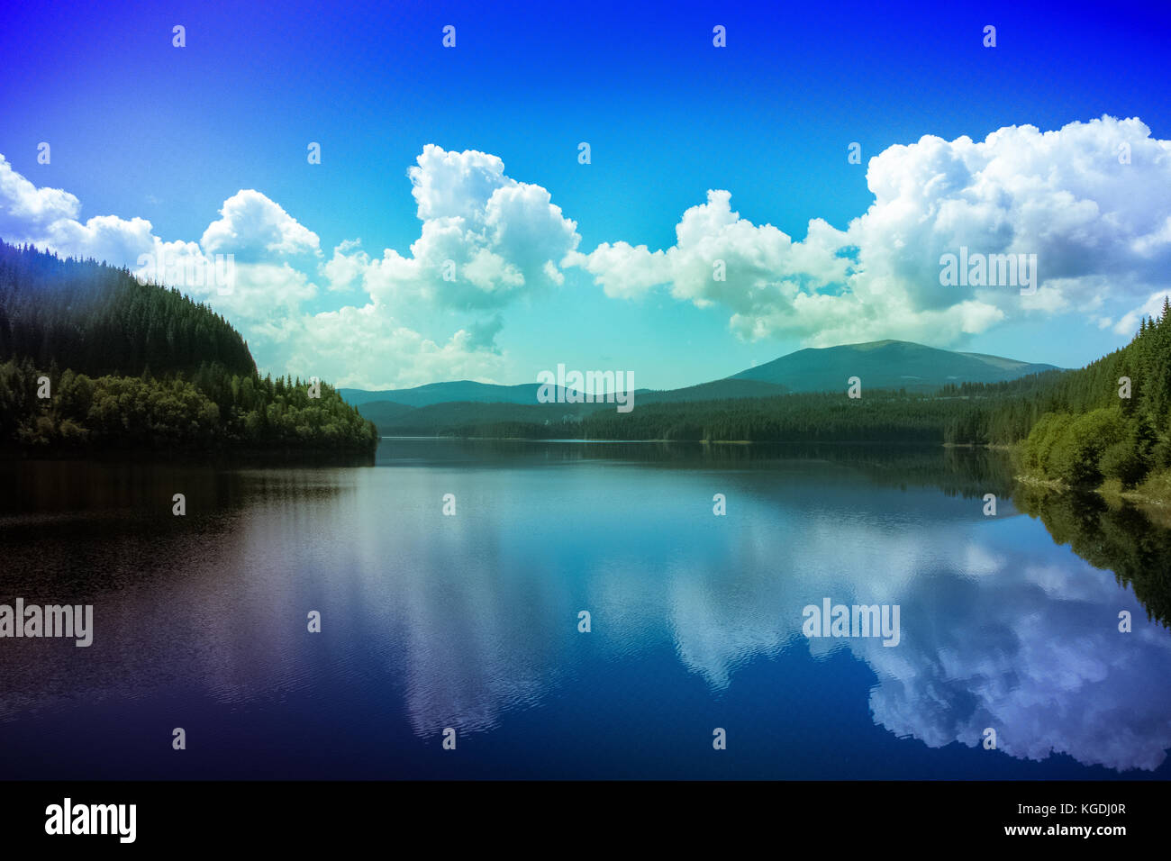 Clouds reflecting in the lake Stock Photo - Alamy