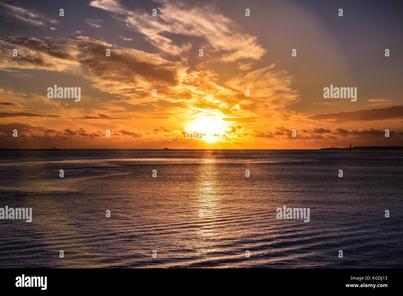 Sunset over the ocean Stock Photo - Alamy