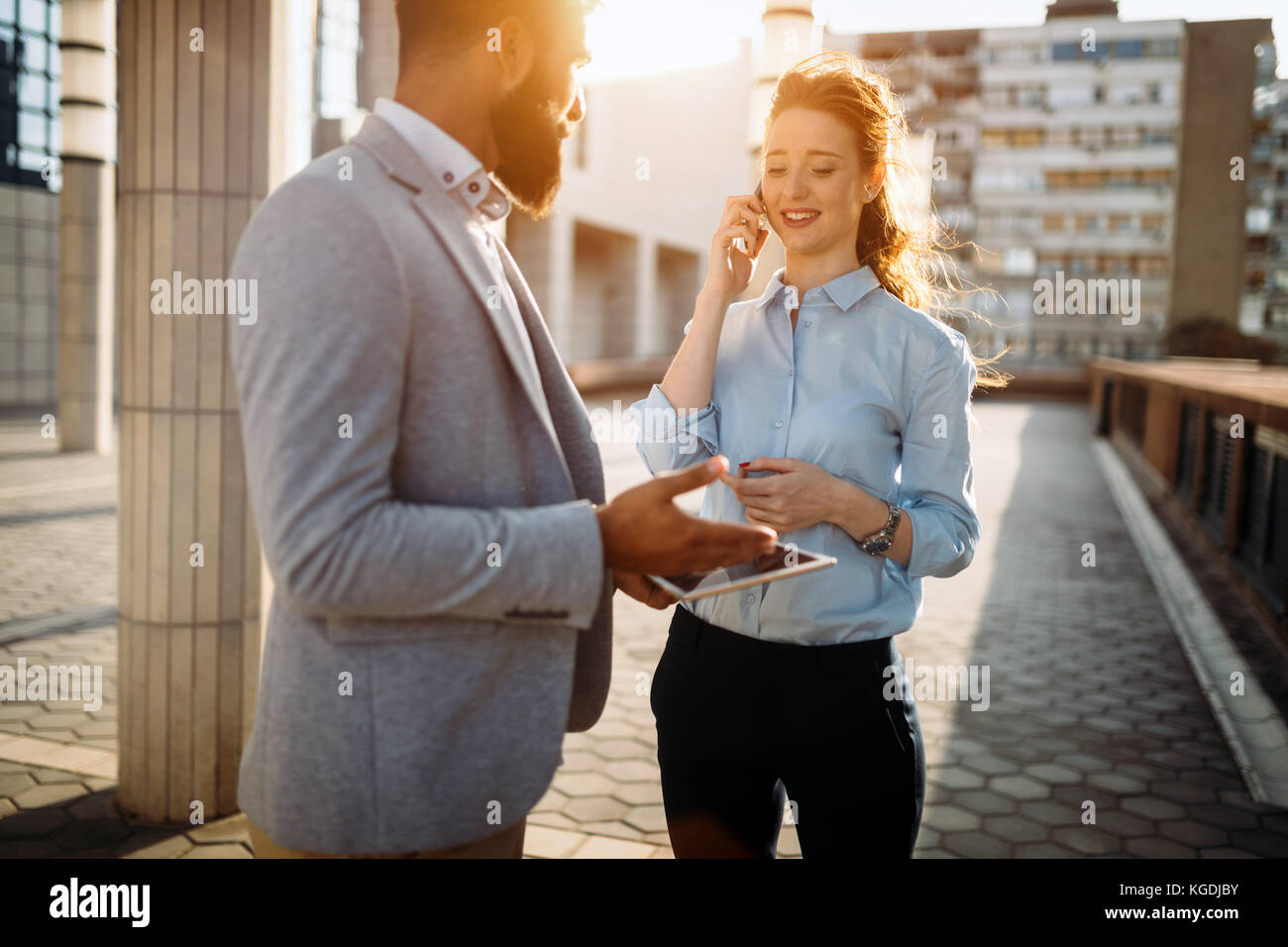 Business colleagues talking on break from work Stock Photo - Alamy