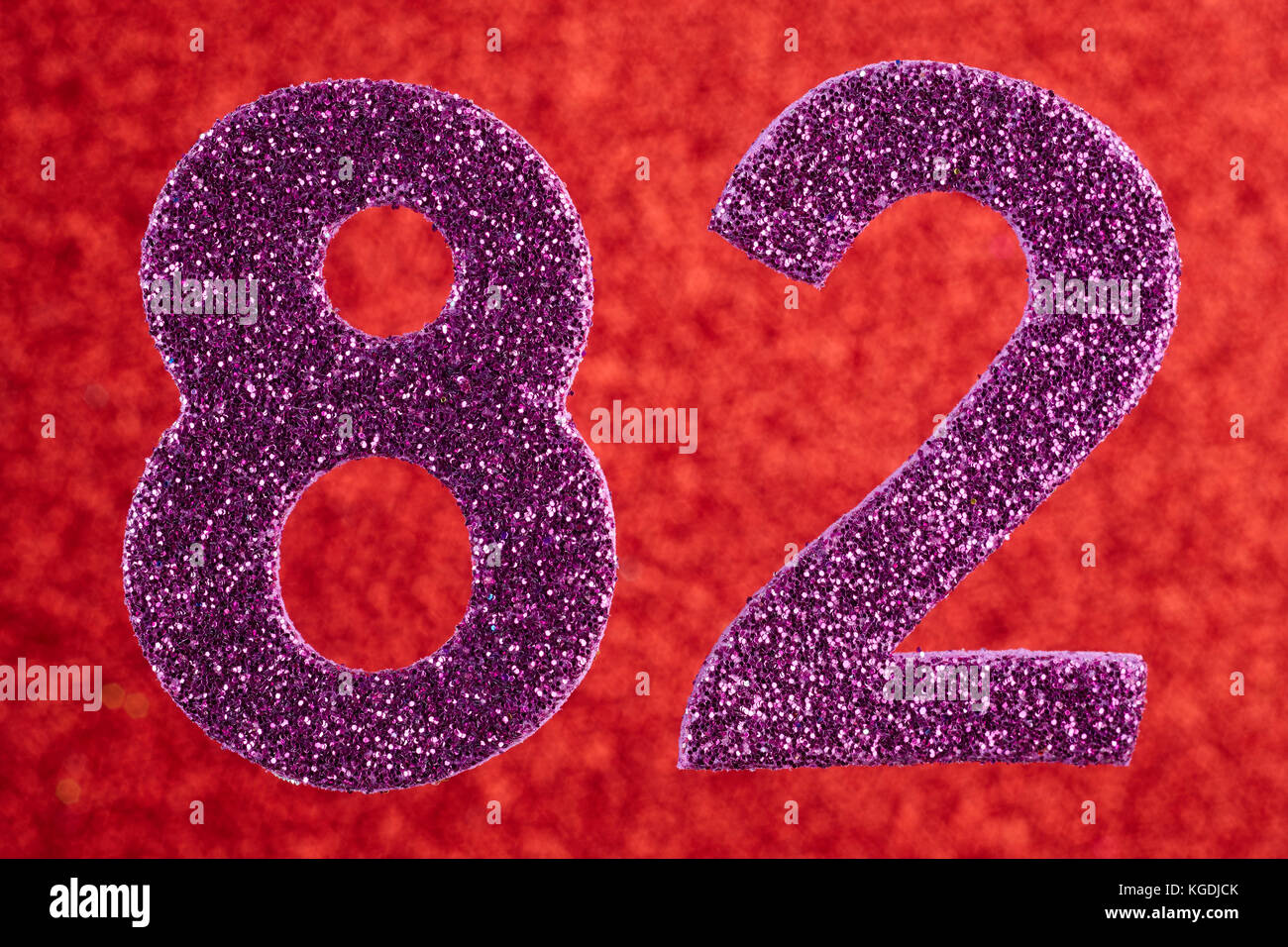 Number eighty-two purple color over a red background. Anniversary ...