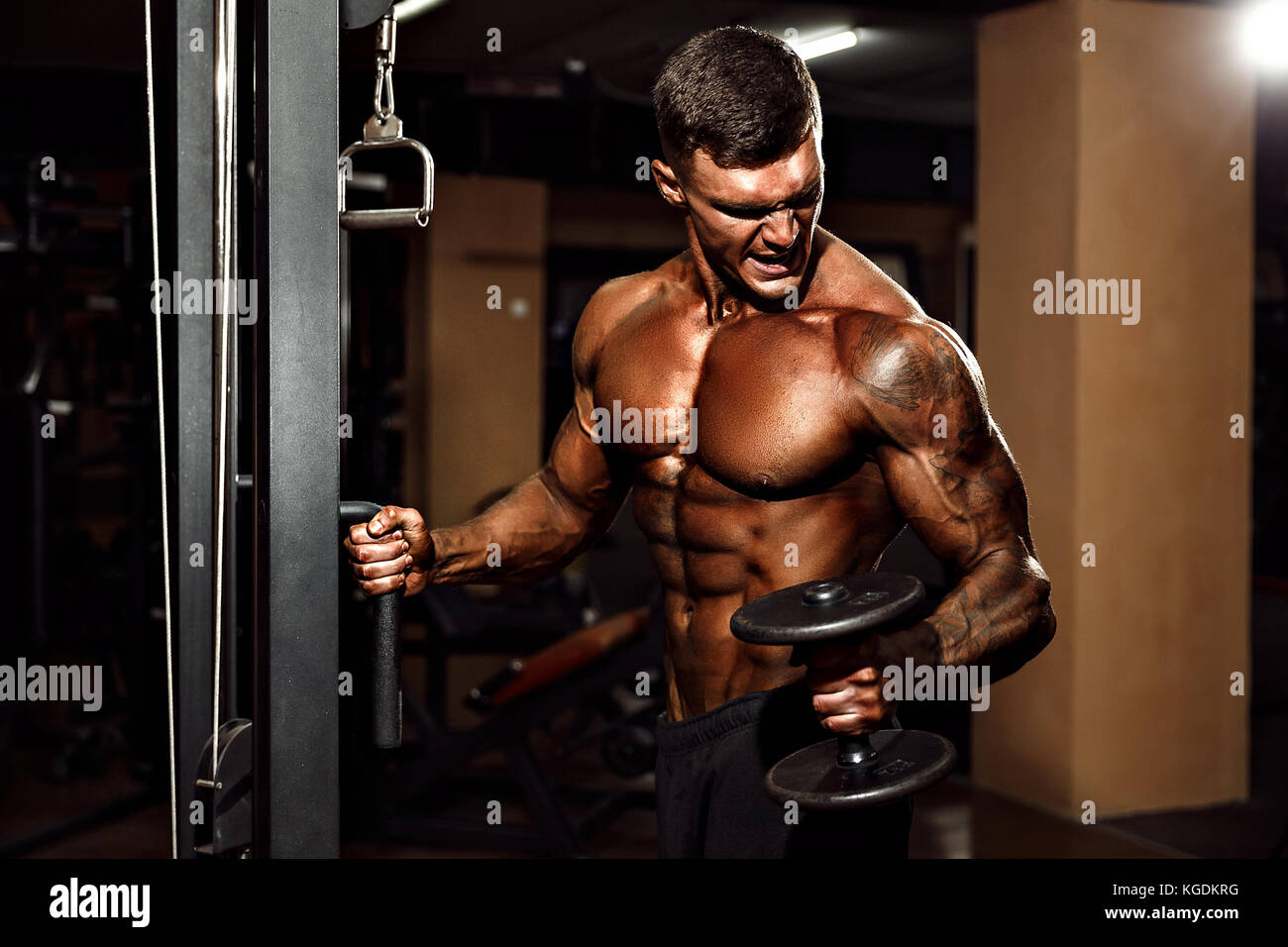 Young Bodybuilder Doing Exercise For Biceps Stock Photo - Alamy