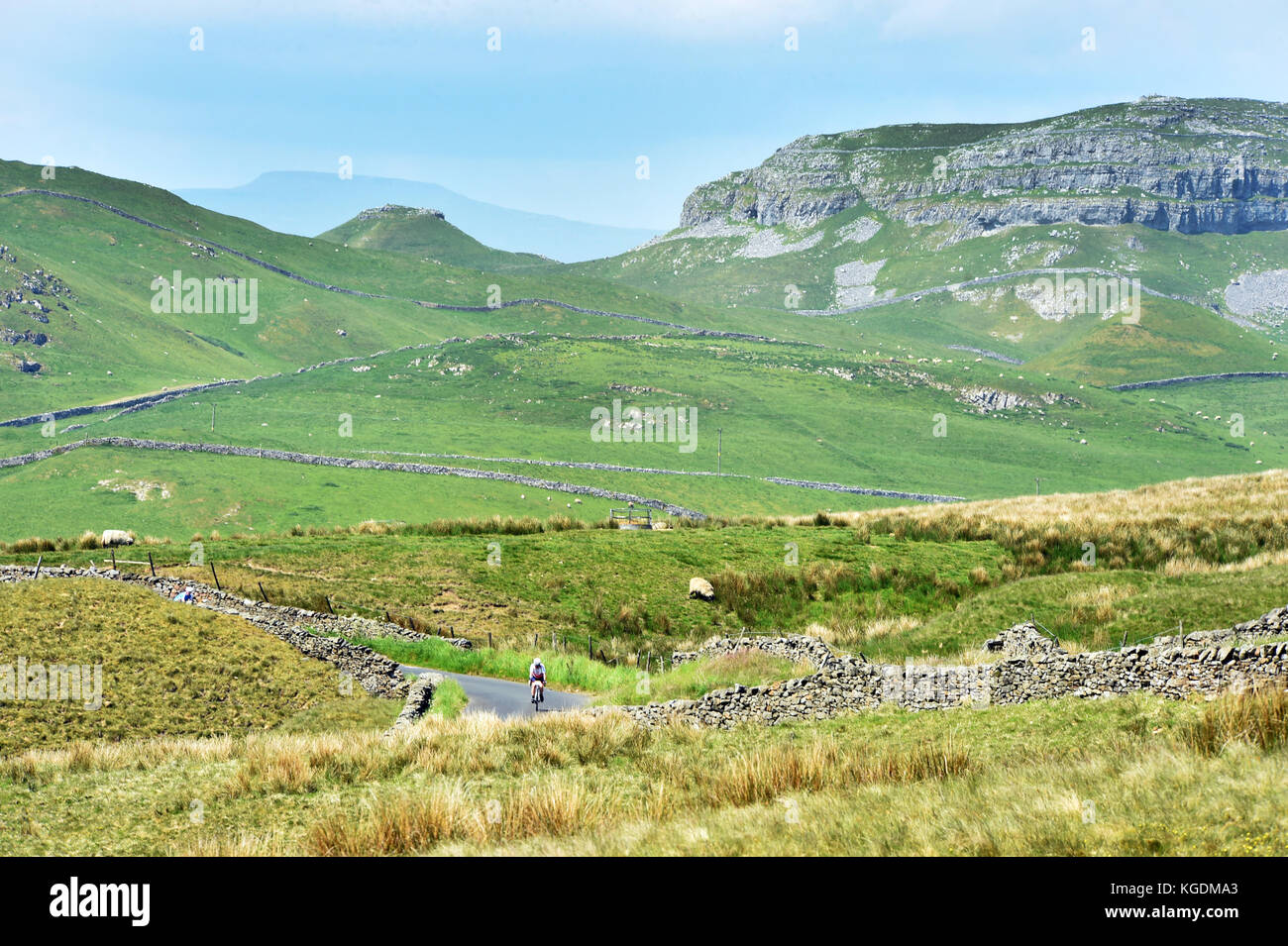 A cyclist cycling in the beautiful Yorkshire Dales Attermire Scar near ...