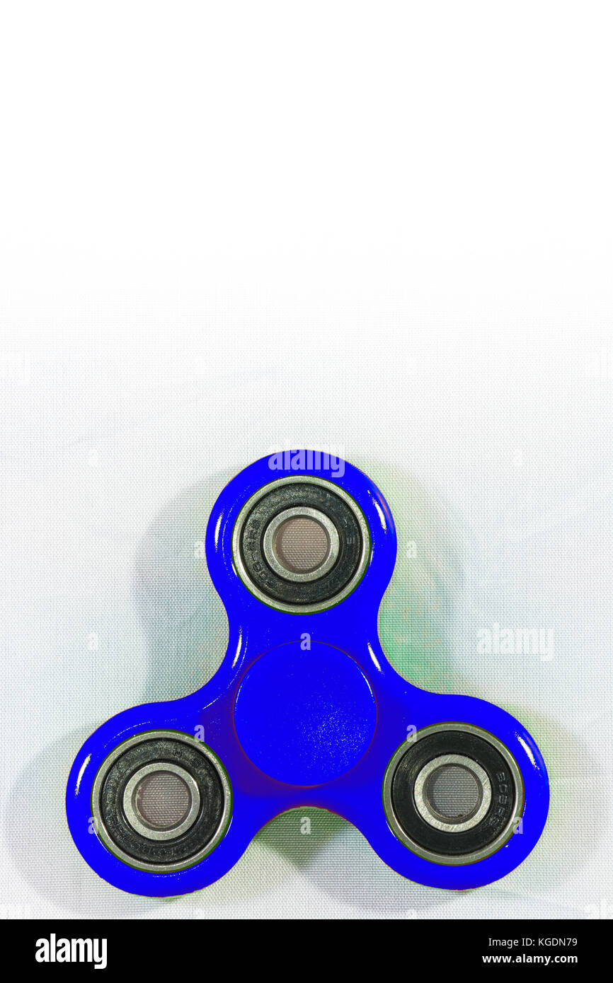 Fidget Spinner in white isolated background. The fidget spinner is a ...
