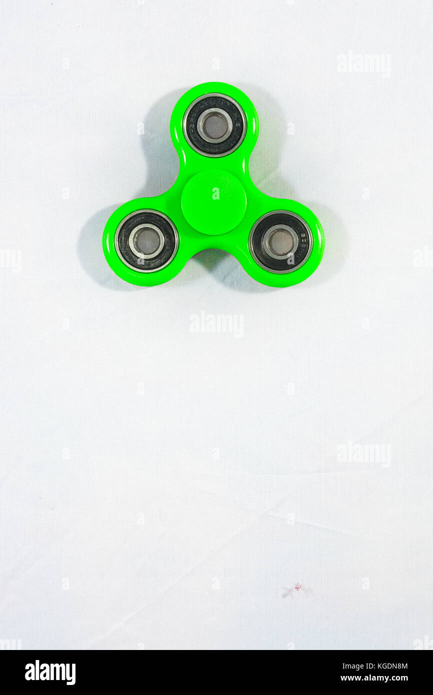 Fidget Spinner in white isolated background. The fidget spinner is a ...