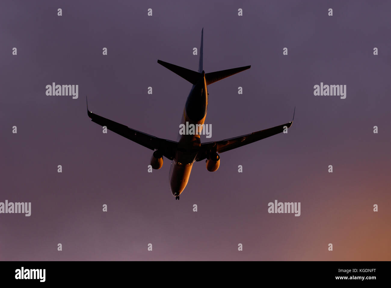 Plane flying through clouds in the sky. Jet aircraft in the air Stock ...