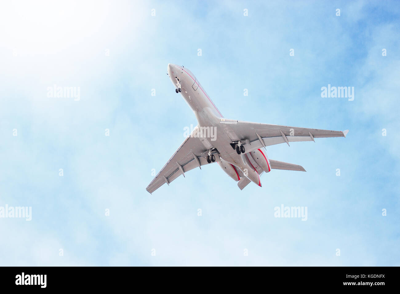 Plane flying through clouds in the sky. Jet aircraft in the air Stock ...