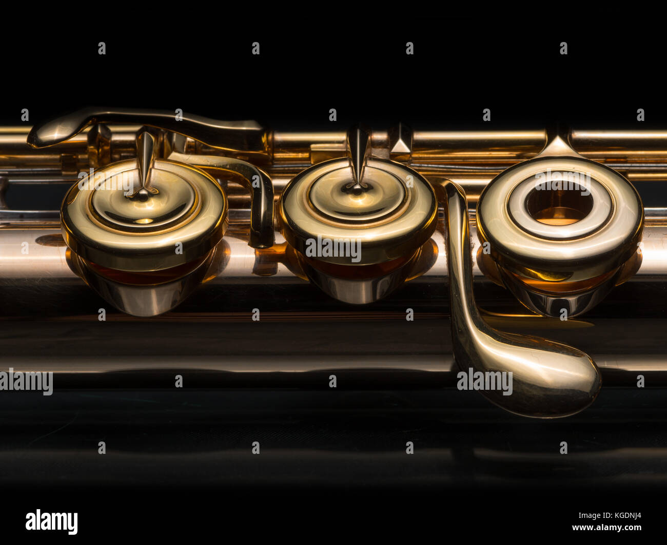 Details, keys of a golden flute black background Stock Photo - Alamy