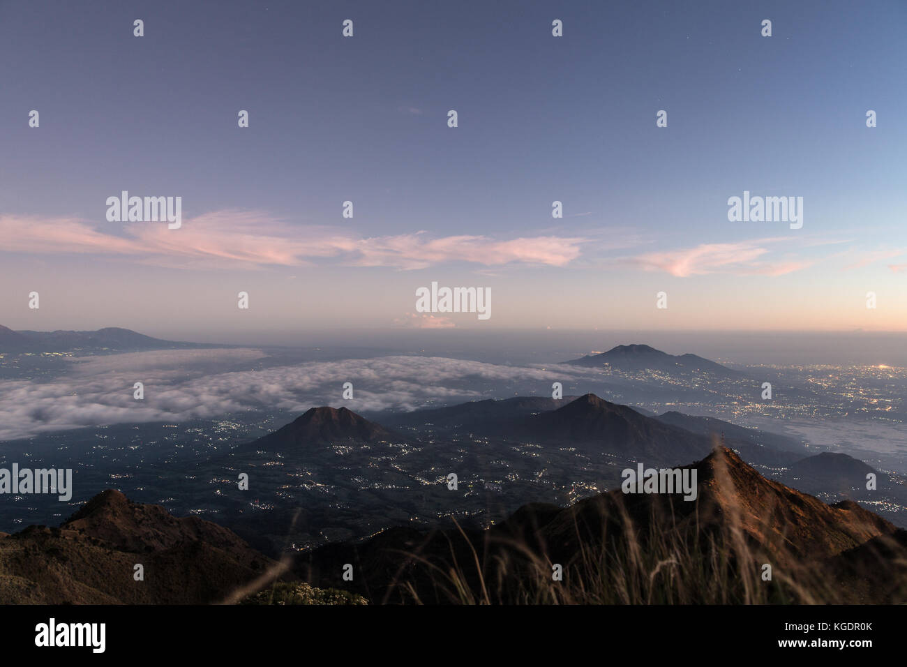 Sunrise from the summit of Merbabu volcano over the plain of Java near ...