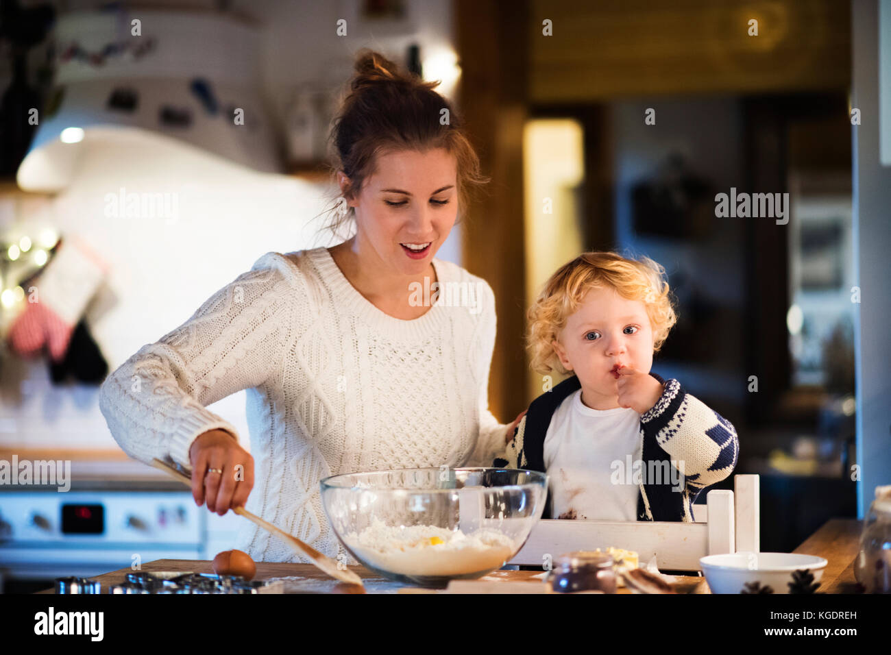 Young family making cookies at home Stock Photo - Alamy