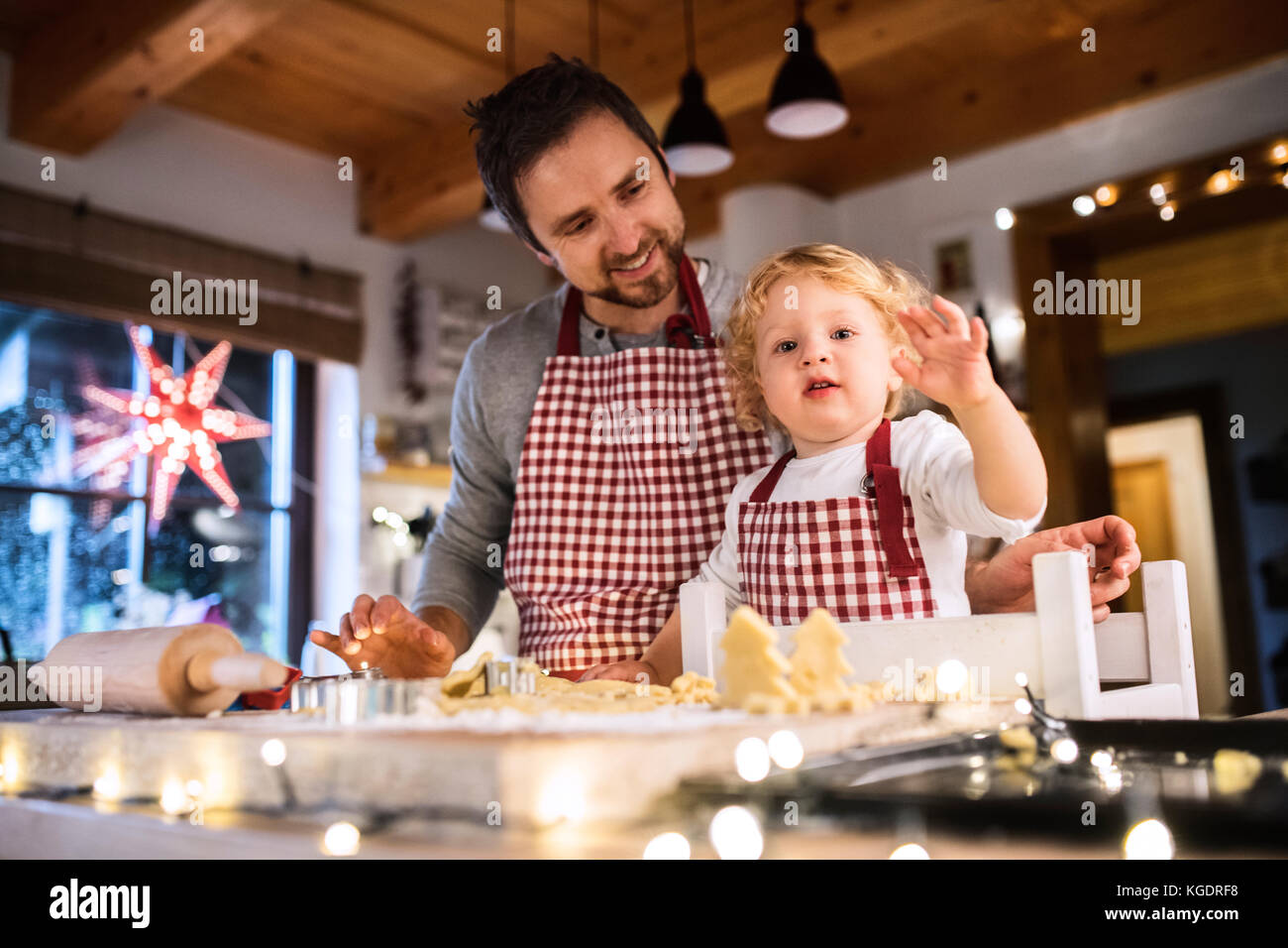 Young family making cookies at home Stock Photo - Alamy