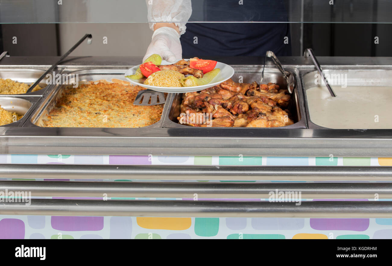 chef standing behind full lunch service station Stock Photo - Alamy