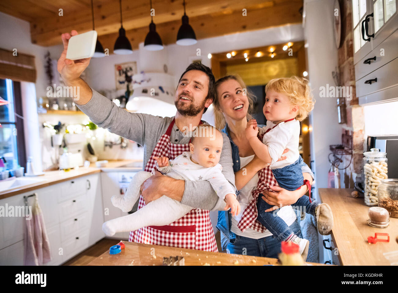 Young family making cookies at home Stock Photo - Alamy
