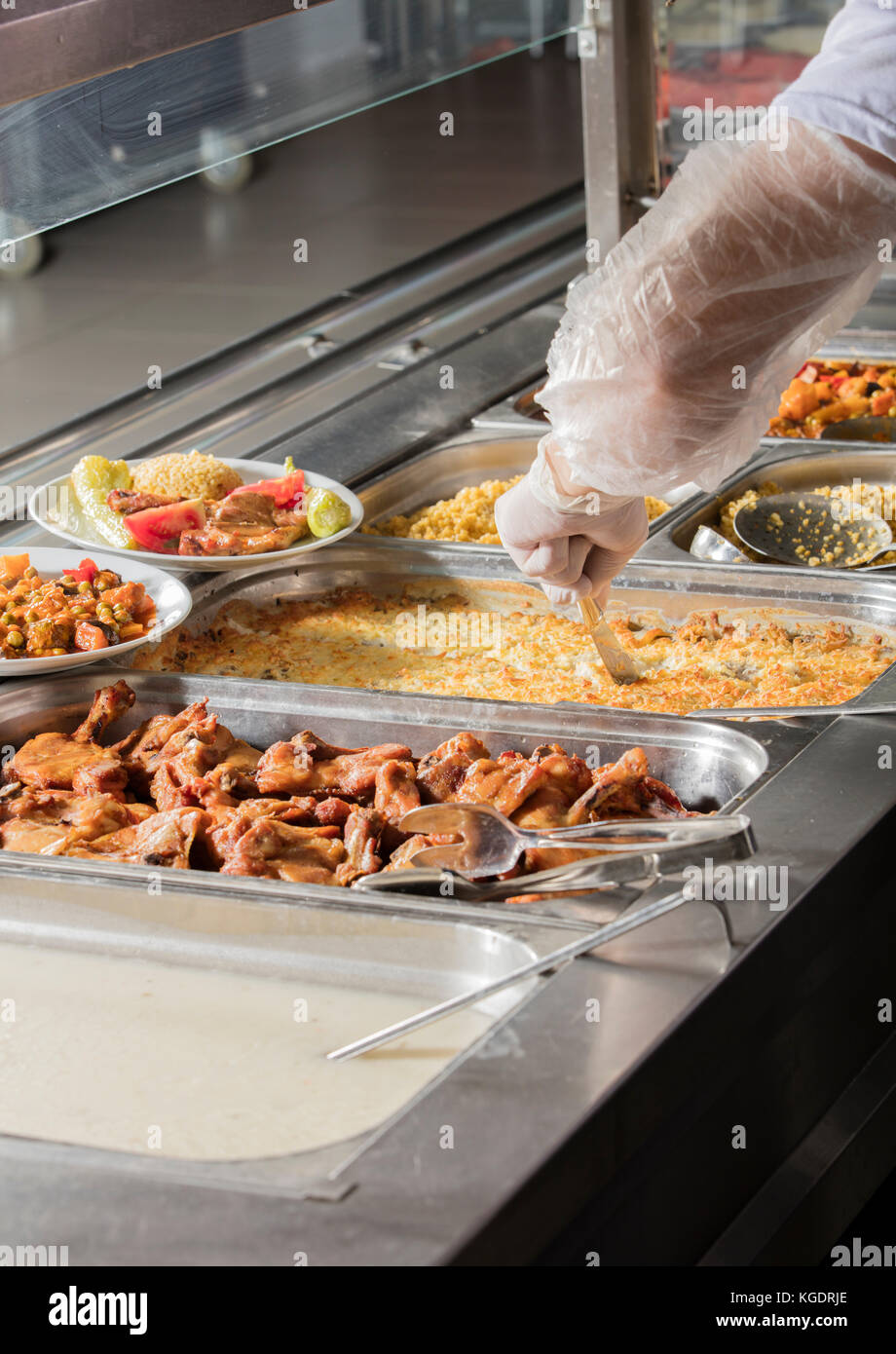 chef standing behind full lunch service station Stock Photo - Alamy