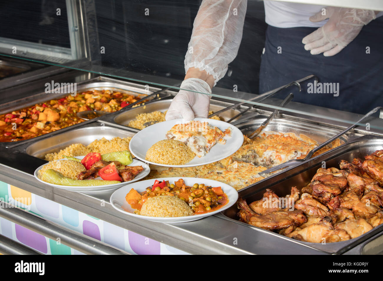 chef standing behind full lunch service station Stock Photo - Alamy