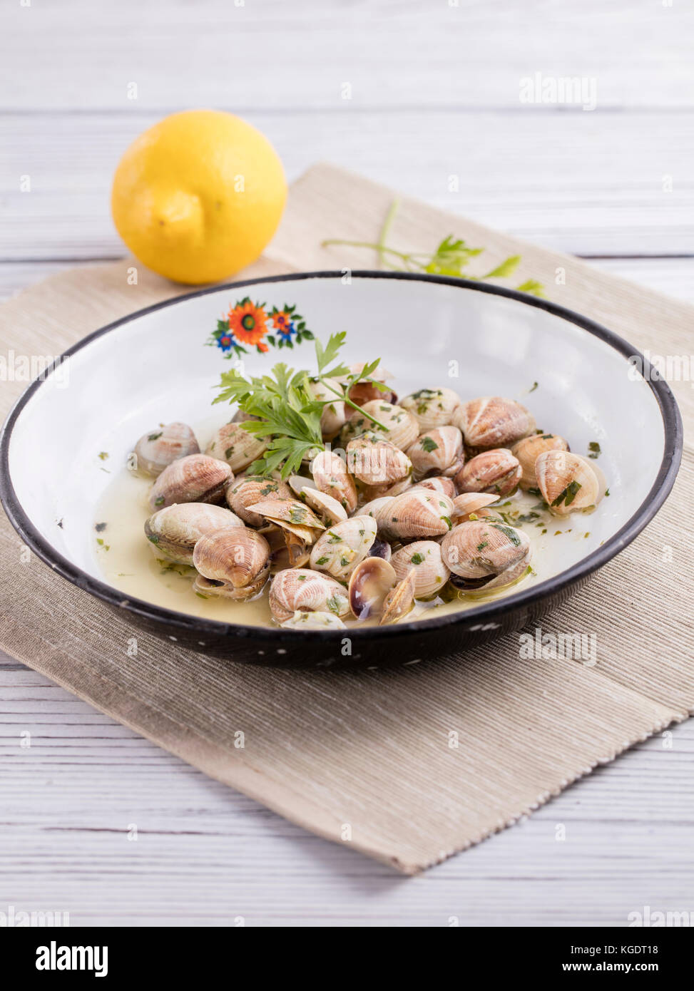 clams in very old plate with green parsley Stock Photo - Alamy