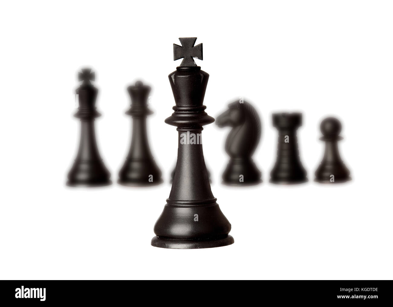 Black chess team with the king close-up isolated on a white background ...