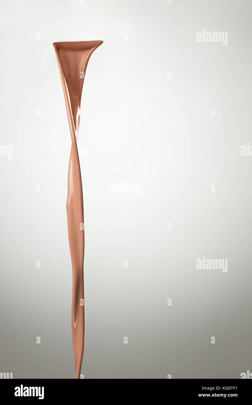 Melted hot chocolate syrup is dripping. Streams with drops isolated on ...