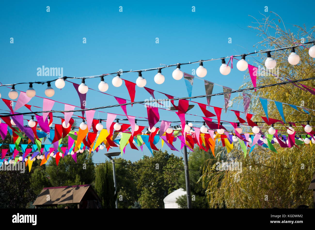 Colorful flags and lamps during celebrations Stock Photo - Alamy