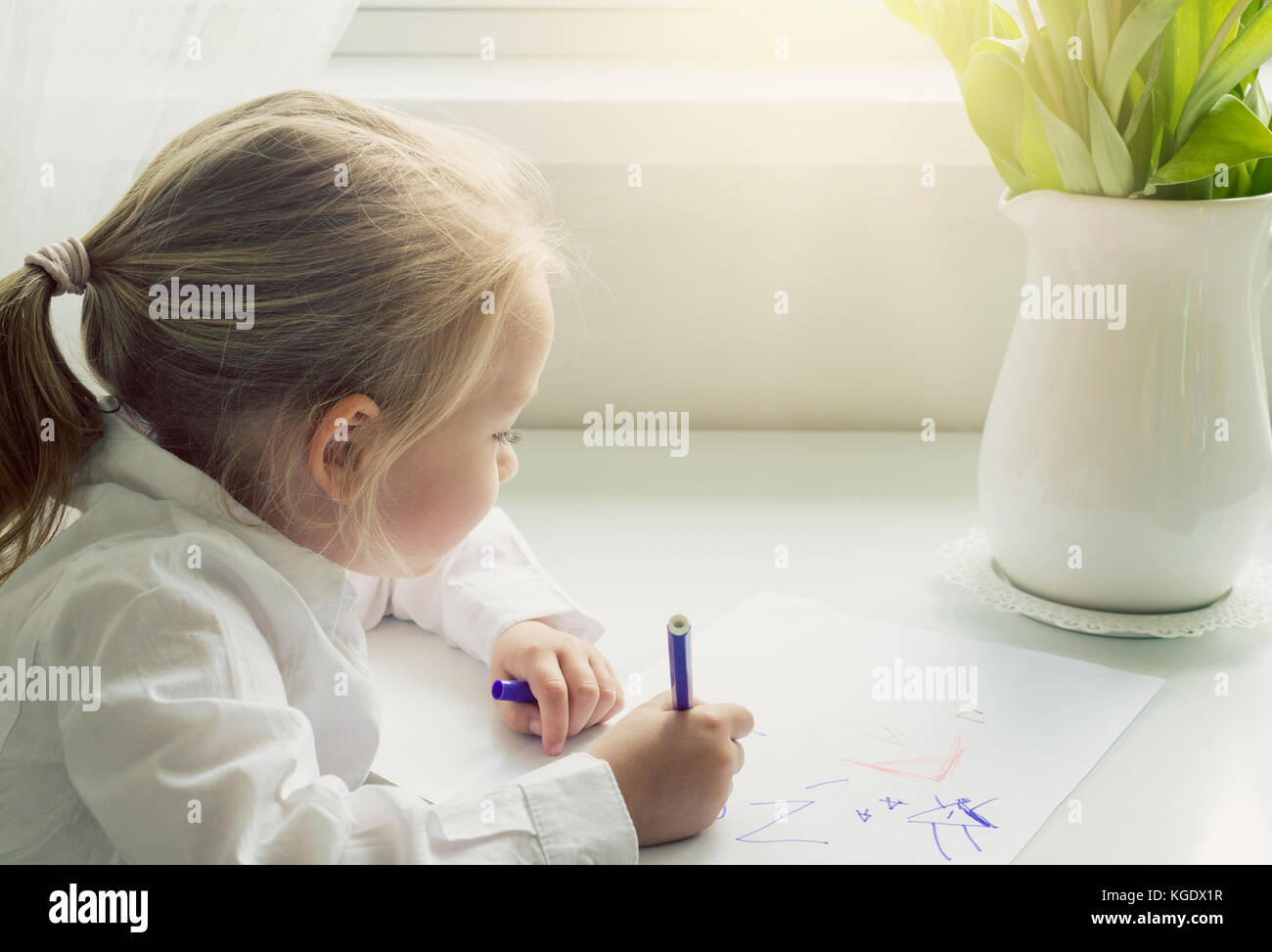 Creativity concept. Little girl drawing Stock Photo - Alamy