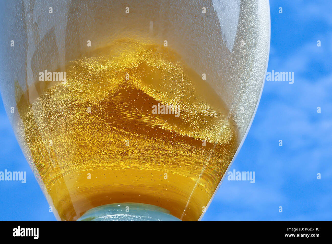 Pouring Beer into the Glass of Beer. Bottom View Stock Photo - Alamy